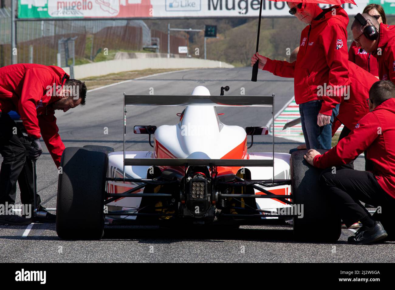 Single seater race car in pole position starting grid rear view on ...