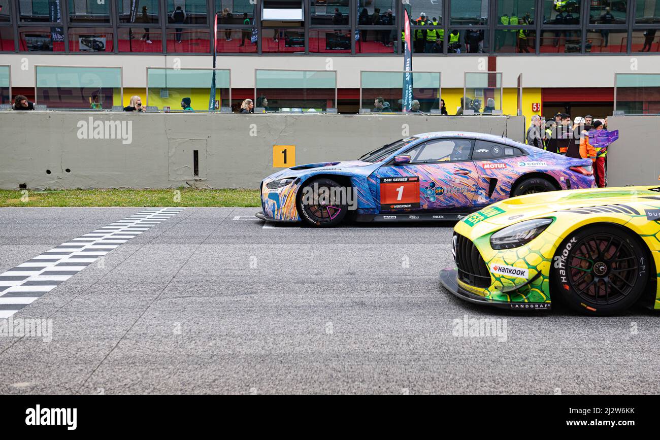 Race cars standing in starting grid, BMW M4 ST racing and Mercedes AMG ...