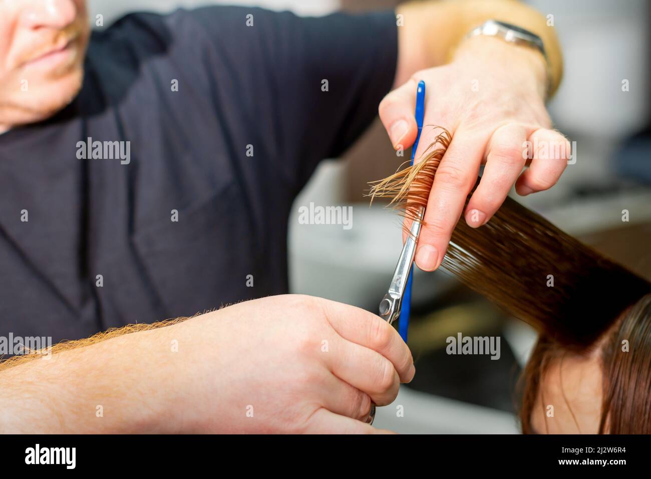 Scissors cutting hair strand hi-res stock photography and images - Alamy