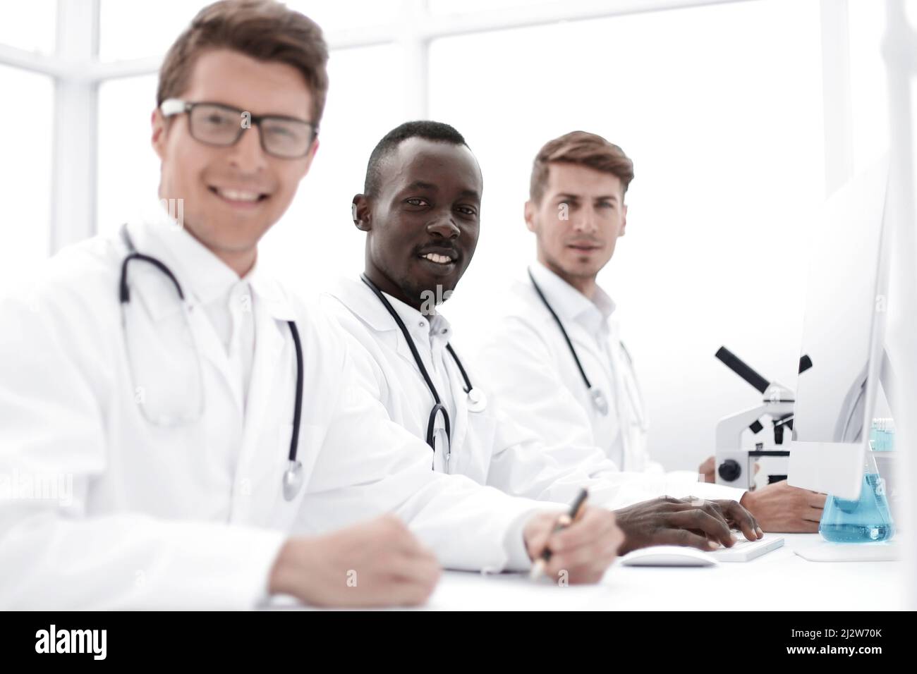 laboratory staff sitting at the Desk Stock Photo - Alamy