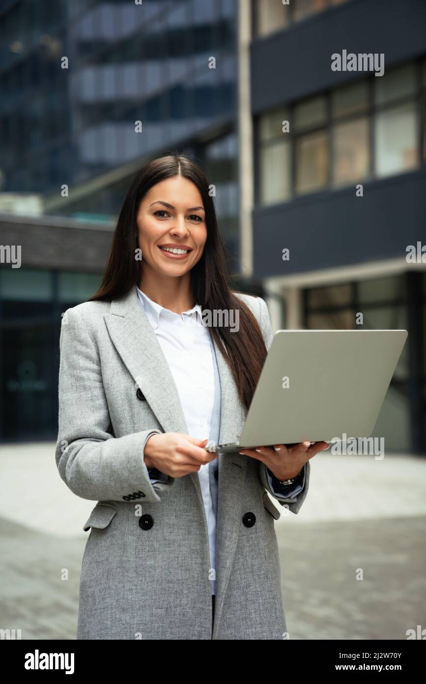 Beautiful business professional woman in the city outdoor. Business ...