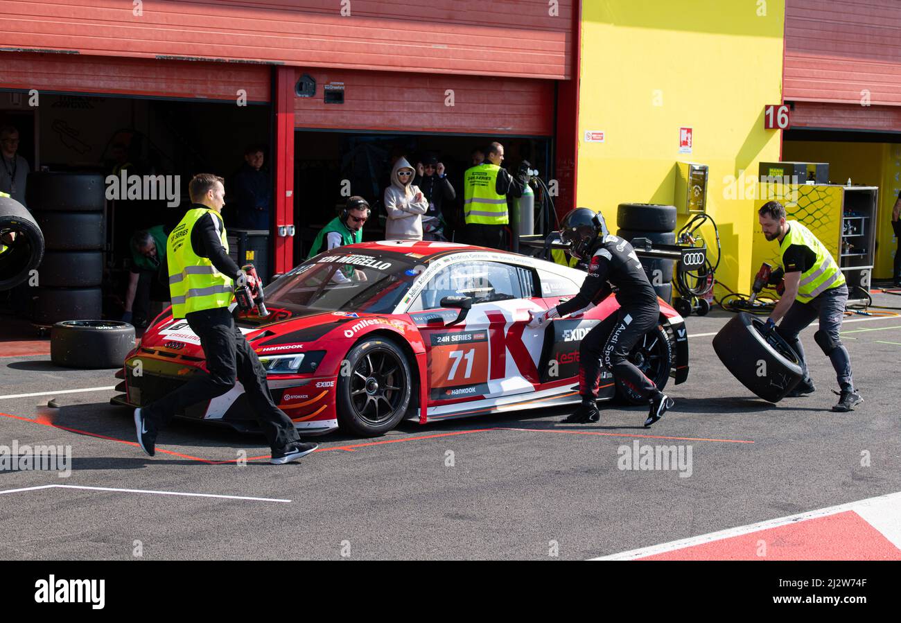 Audi R8 GT race car pit stop with team and driver in pit lane. Mugello ...