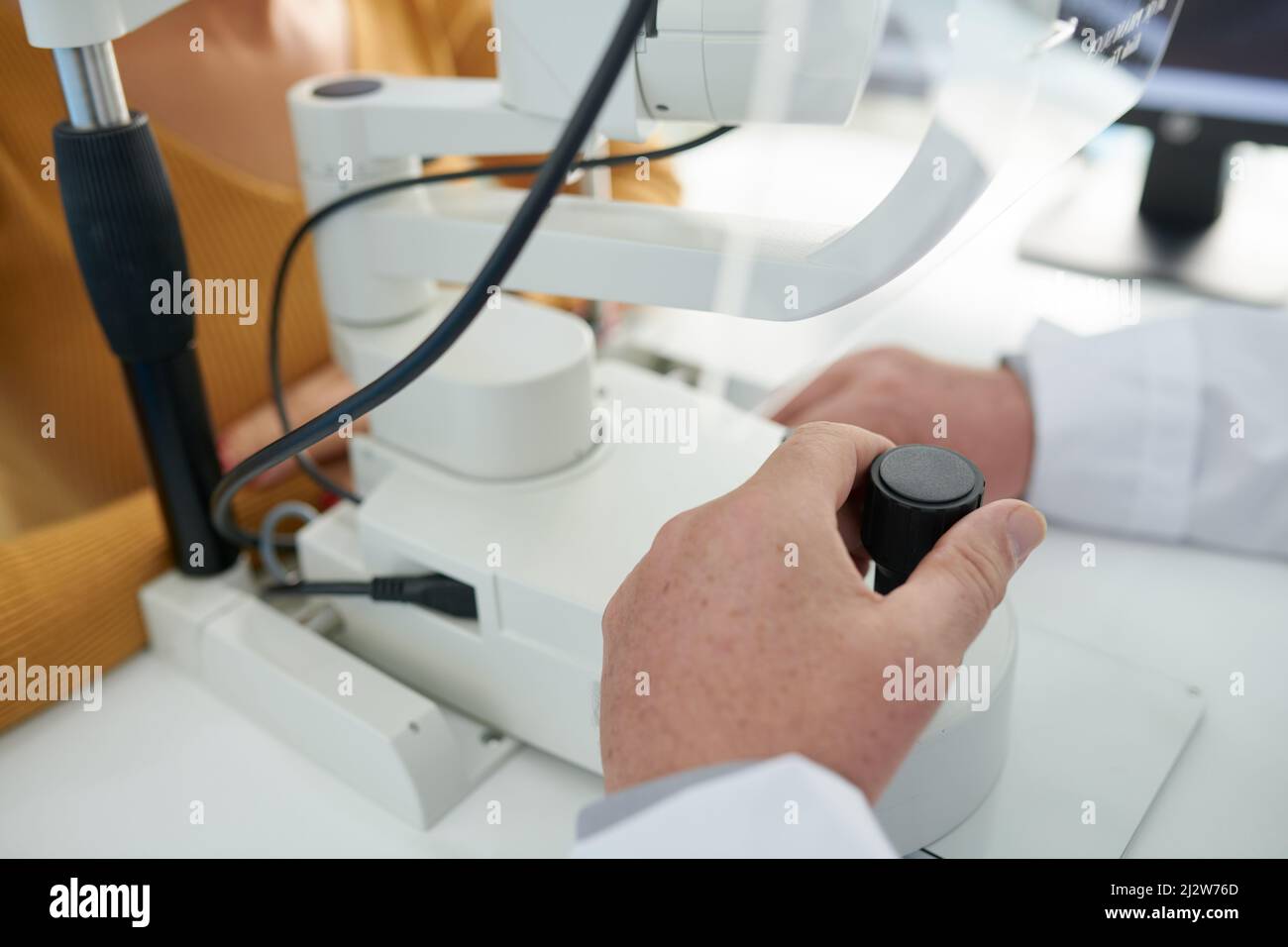 Close-up image of doctor using tonometer to measure intraocular ...