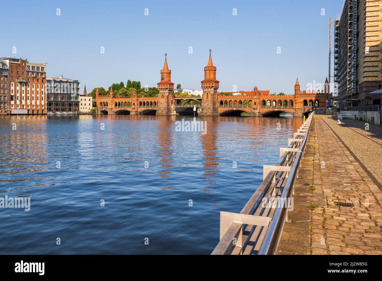 River Spree promenade with view to the Oberbaum Bridge (Oberbaumbrucke ...