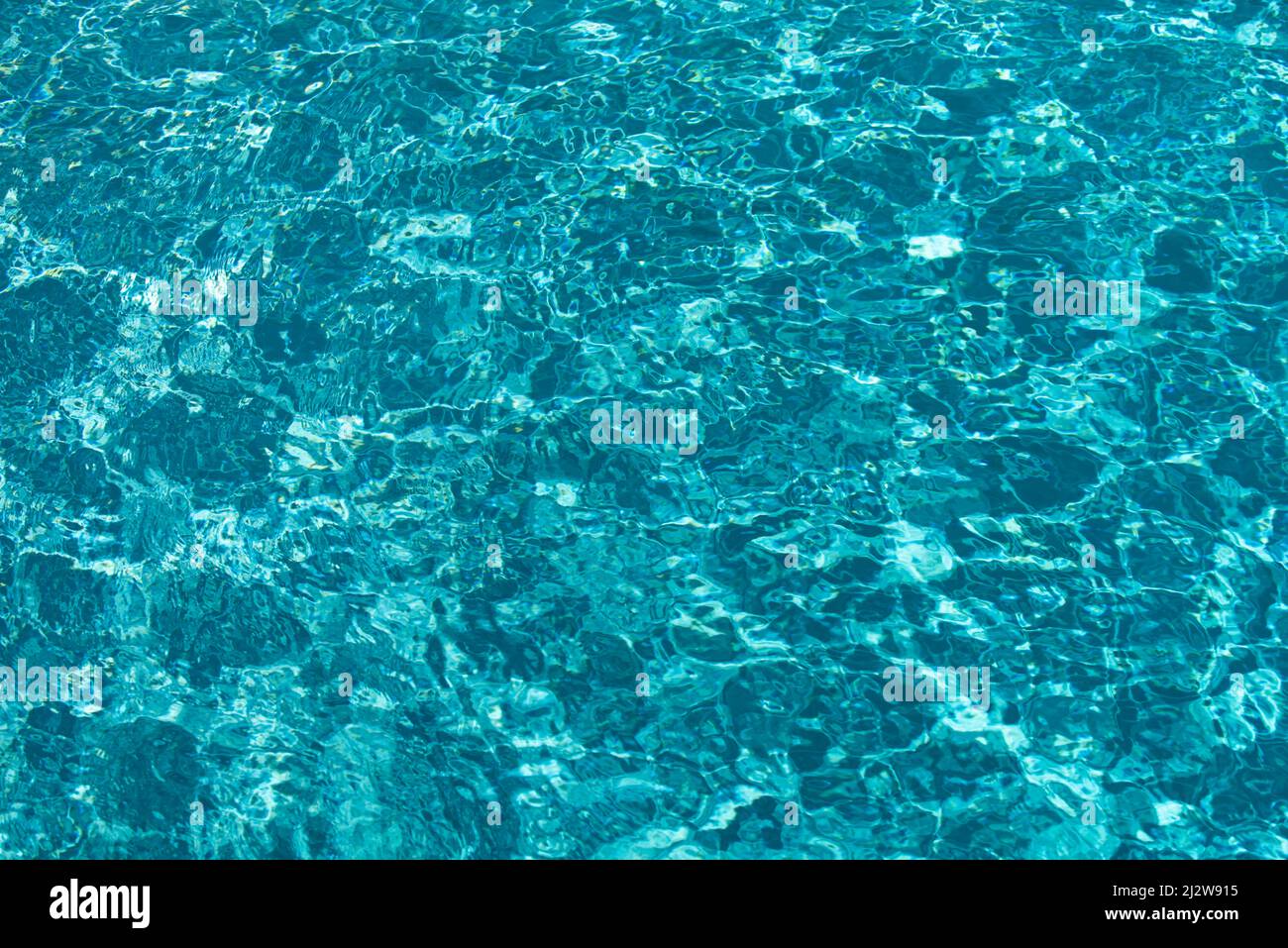 Background of blue water in swimming pool with sun reflection, ripple ...