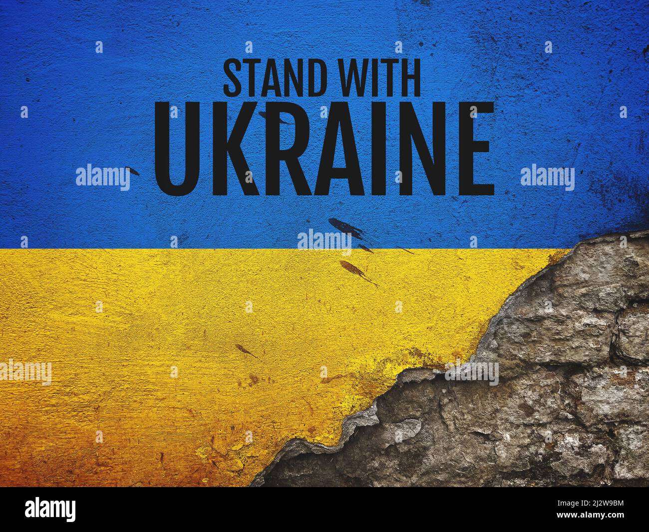 Stand with Ukraine message on worn old brick wall painted in colors of ...