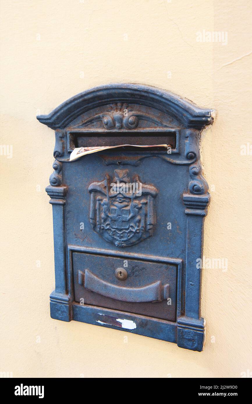 old metal mailbox on a smooth wall. copy of the space. mailbox for ...