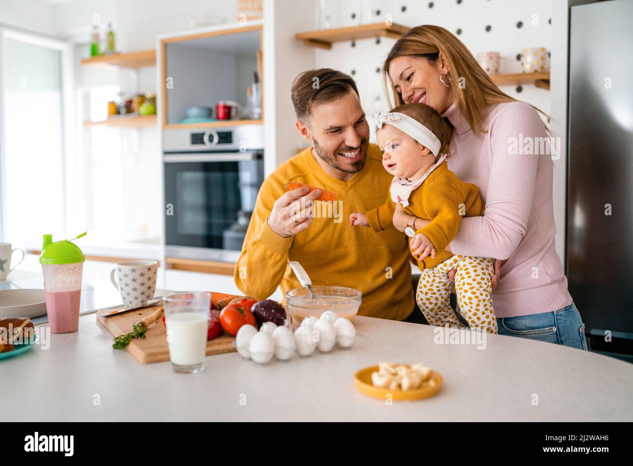 Happy family with children playing and cuddling at home Stock Photo - Alamy