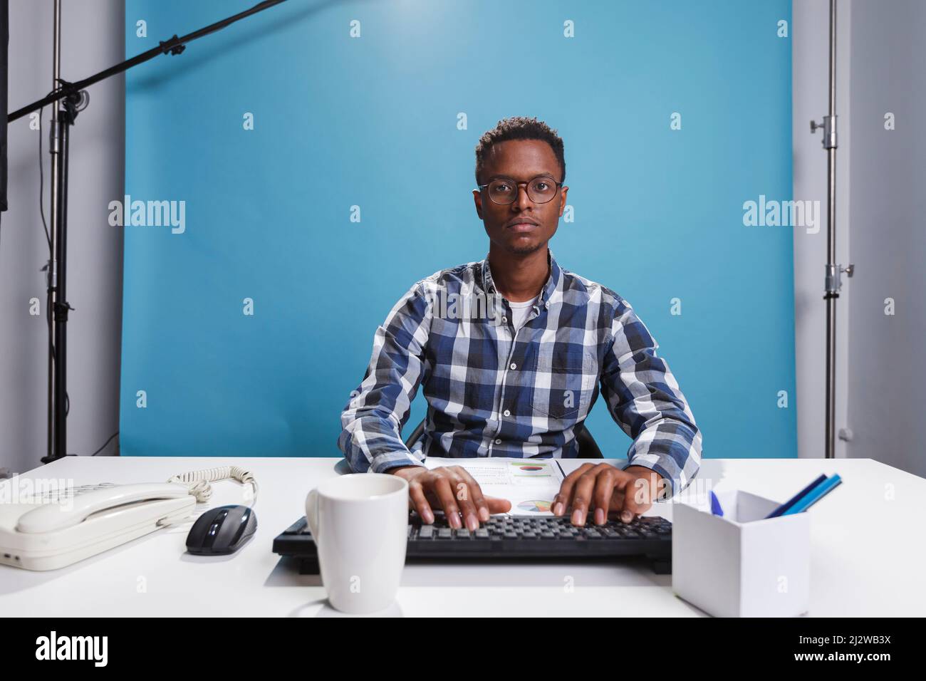 Behind the scenes of young adult business company office worker using ...