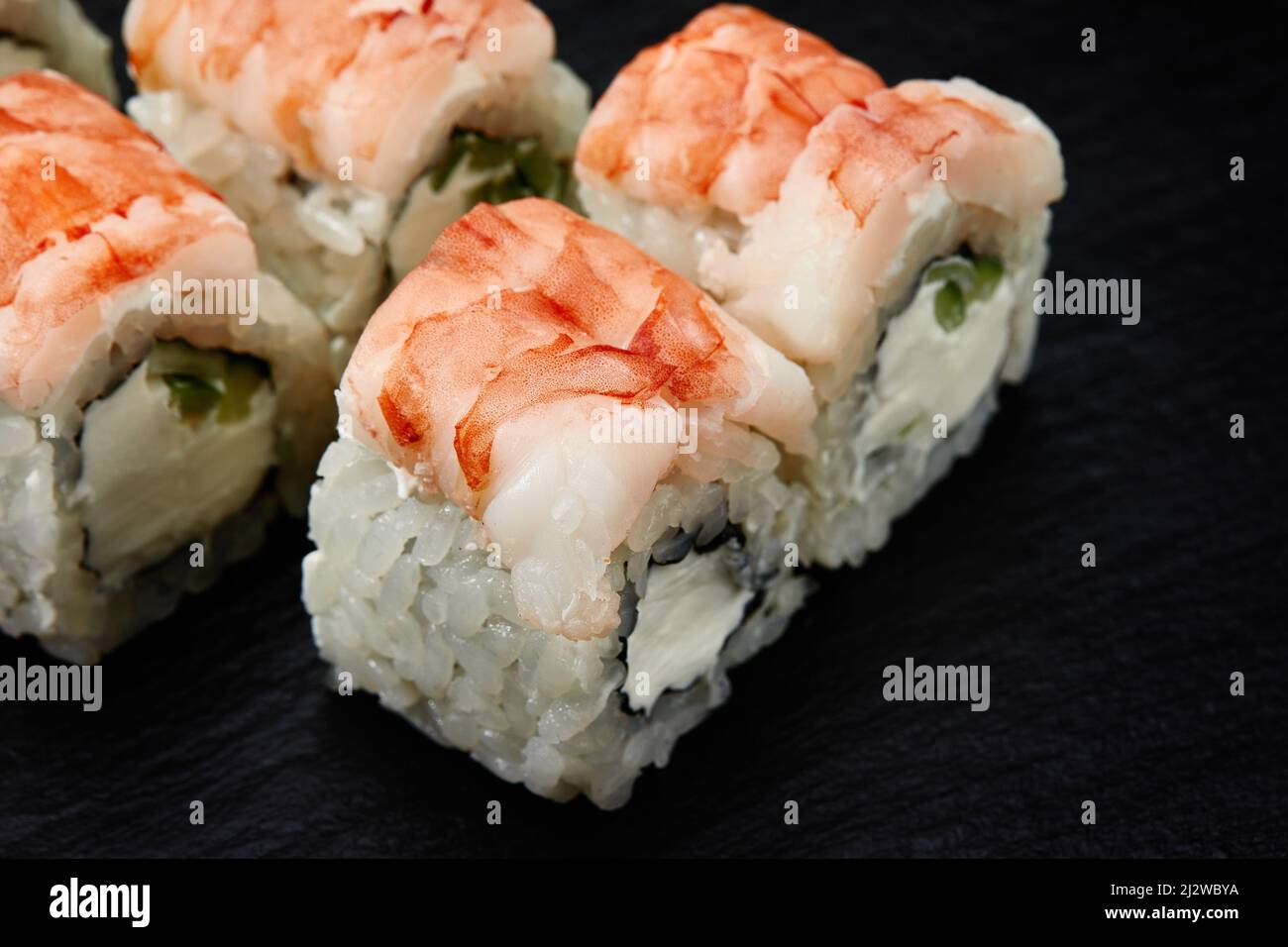 Sushi rolls Philadelphia with snow crab, cream cheese, cucumber, sesame ...