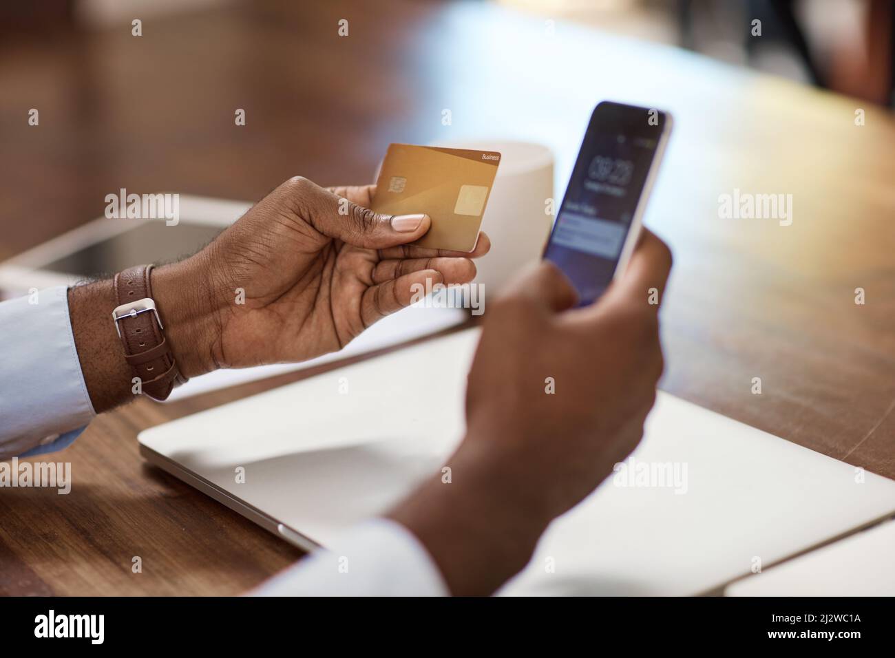 Banking made simple. High angle shot of an unrecognizable businessman ...