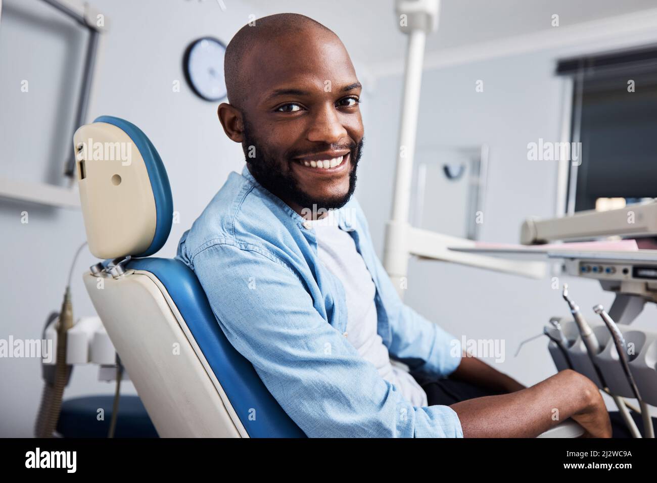 I got my smile back. Portrait of a young man having dental work done on ...