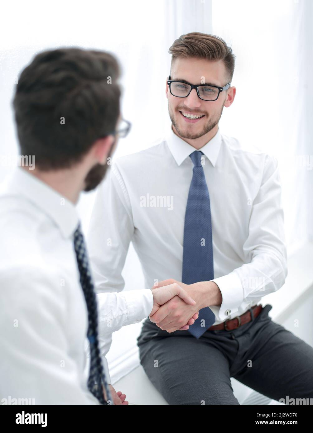close up.welcome handshake of the company's employees Stock Photo - Alamy
