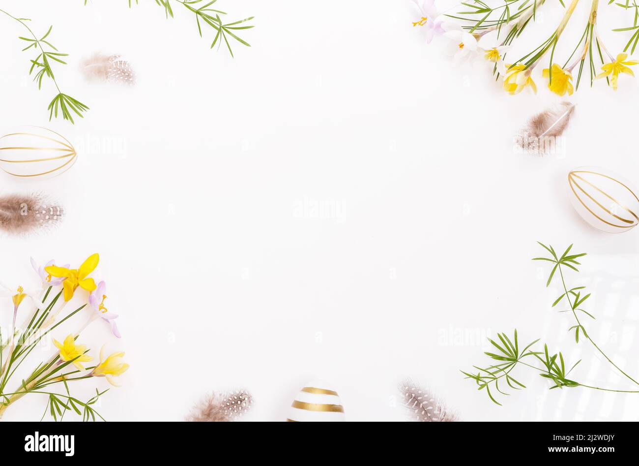 Festive Easter border, frame made of Easter eggs and feathers on a ...