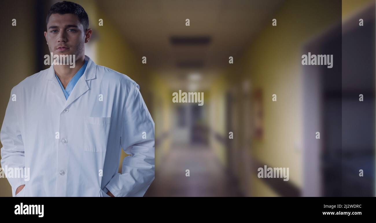 Doctor with hospital hallway in the background, healthcare and medical ...