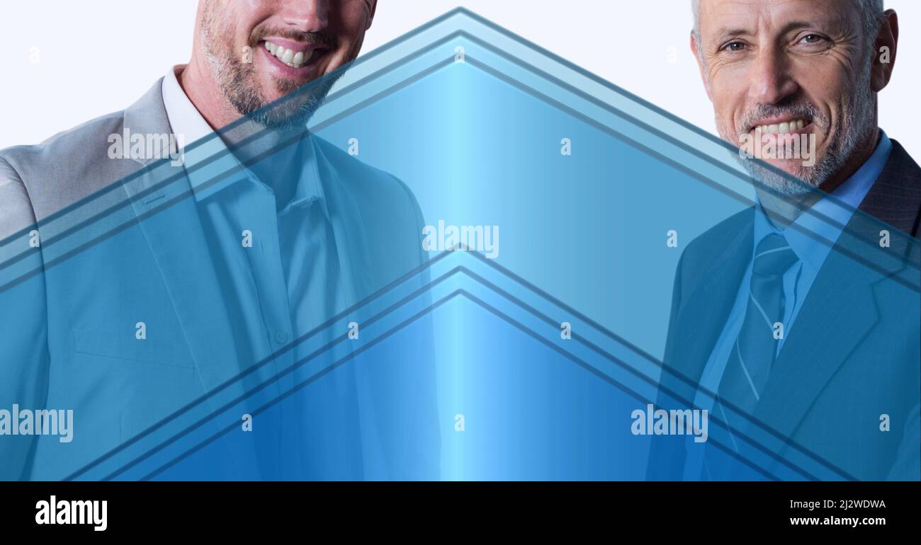 Mid section of two businessmen smiling against blue technology ...