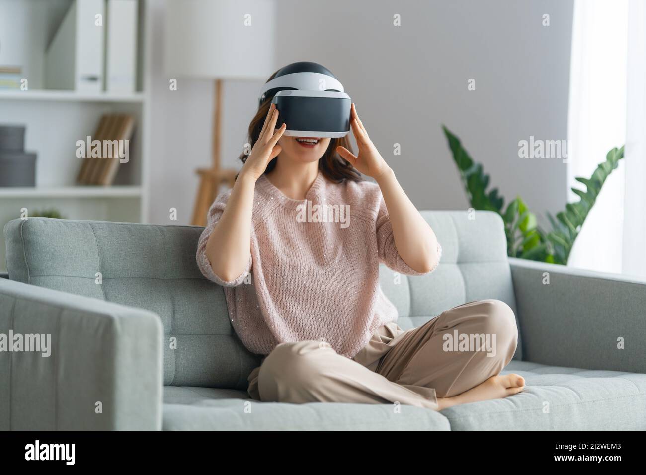 Metaverse technology concept. Woman with VR virtual reality goggles ...