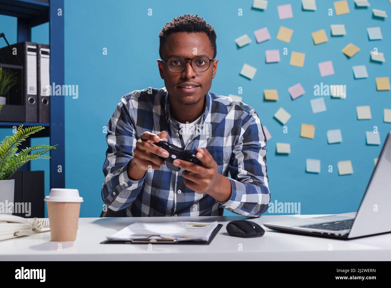 POV of business company employee using electronic videogame controller ...