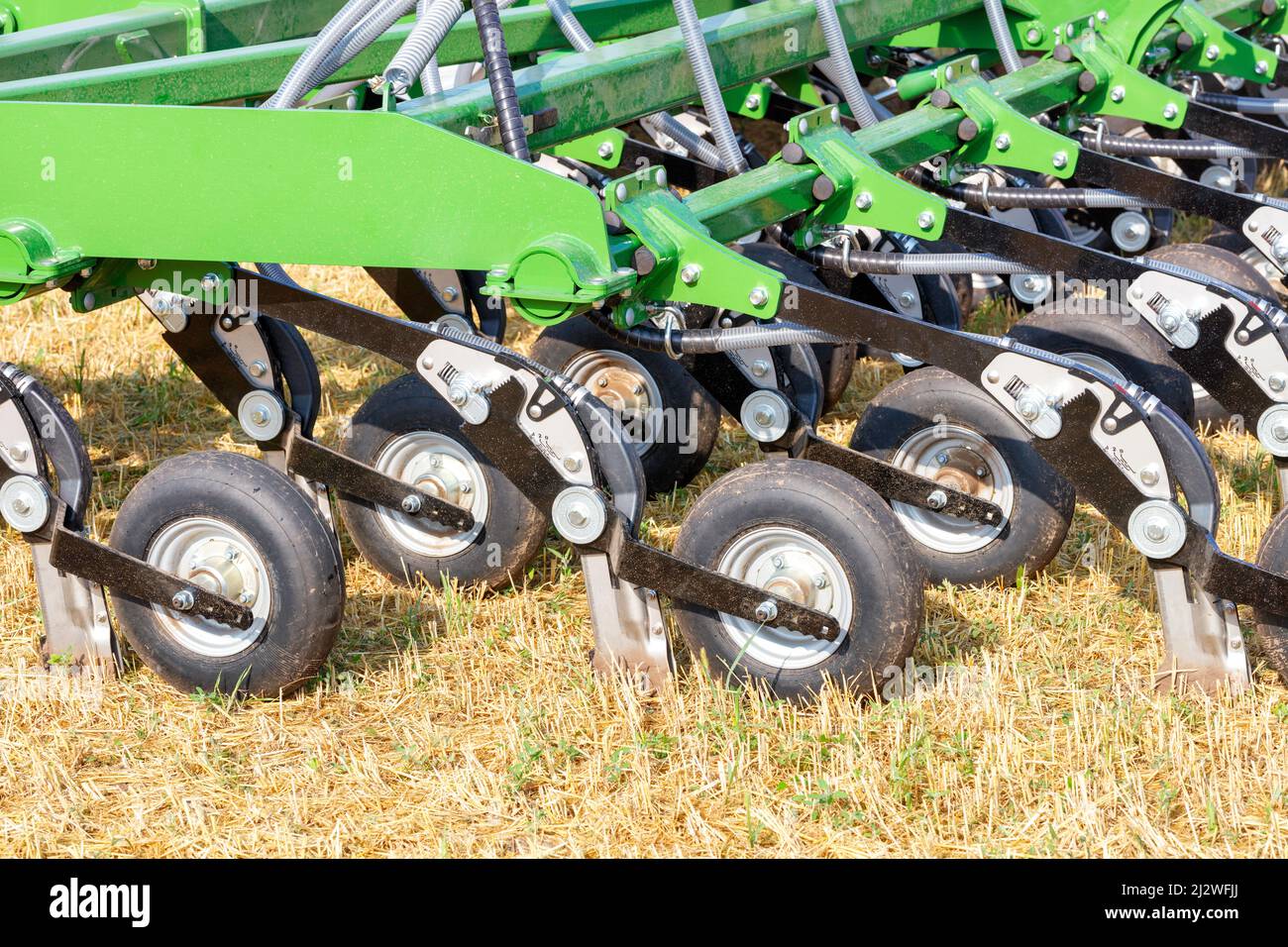 A fragment of a multi row knife harrow for field work against the ...
