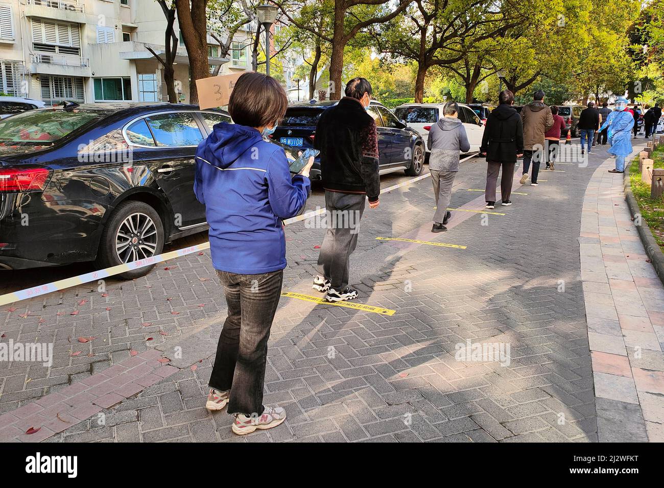 SHANGHAI, CHINA - APRIL 4, 2022 - Citizens line up for nucleic acid ...