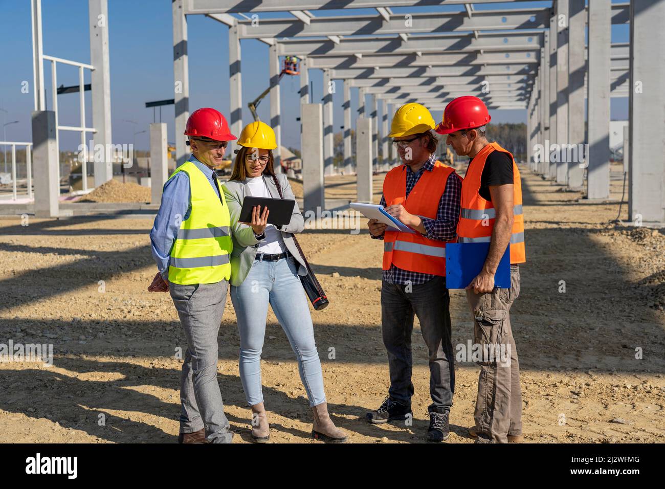 Project Management and Field Crew Meeting on Construction Site ...