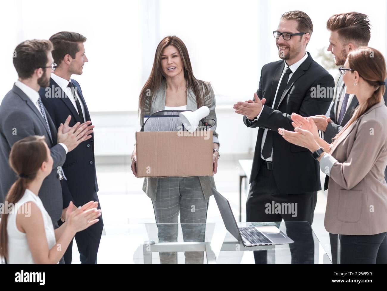 Businesswoman welcomes new company employees hi-res stock photography ...