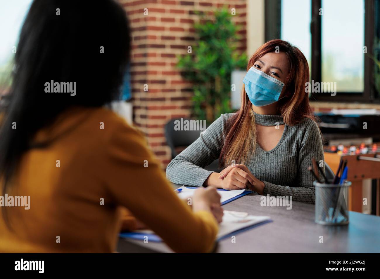 Collegues discussing marketing strategy analyzing company graphs ...