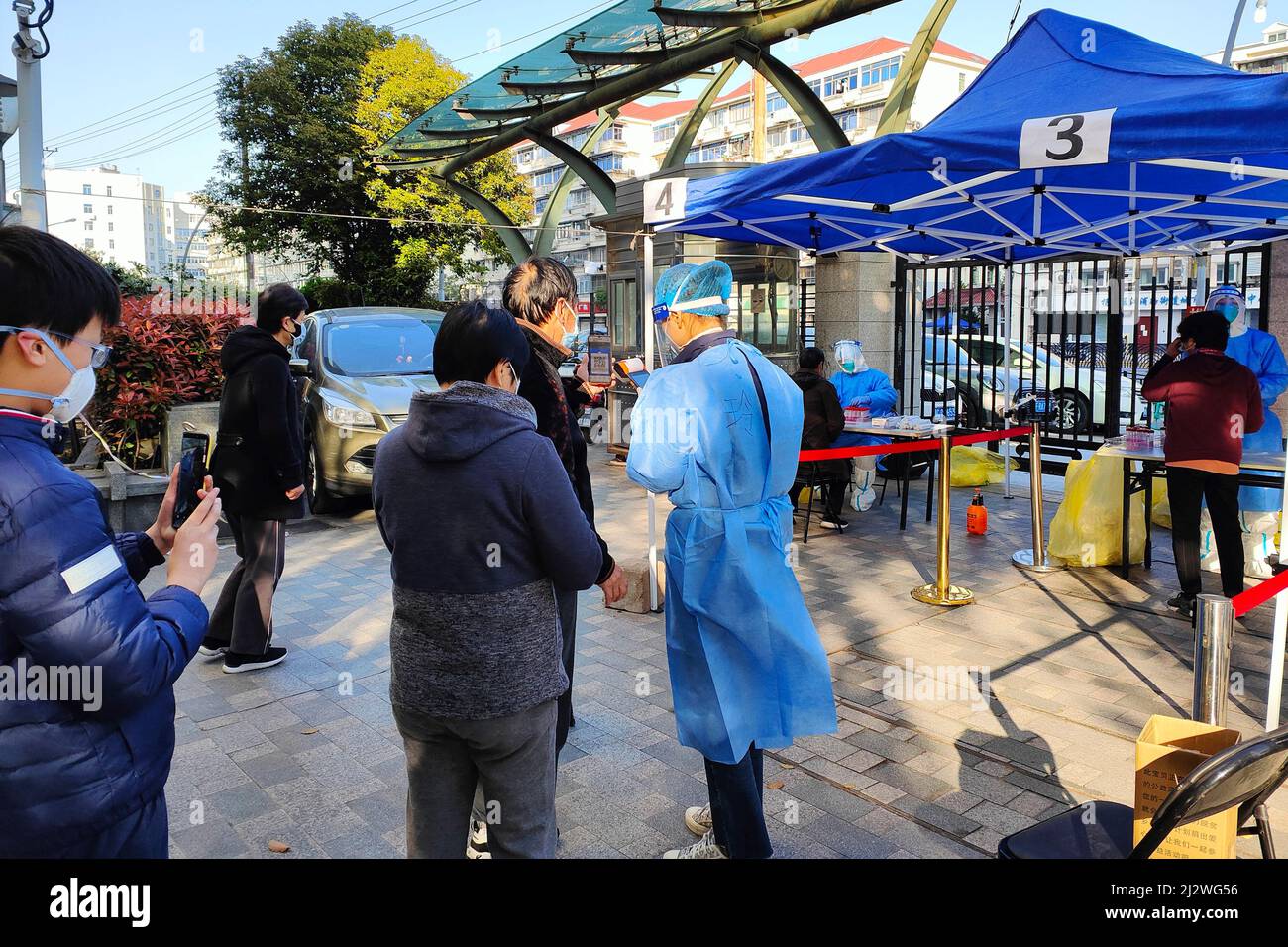 SHANGHAI, CHINA - APRIL 4, 2022 - Citizens line up for nucleic acid ...
