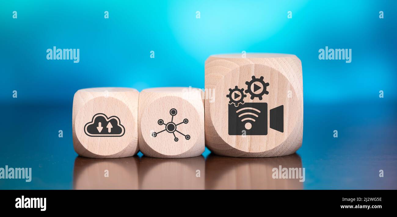 Wooden blocks with symbol of live streaming concept on blue background ...