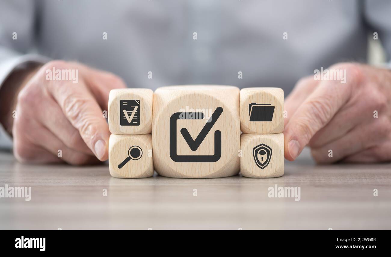 Wooden blocks with symbol of validation concept Stock Photo - Alamy