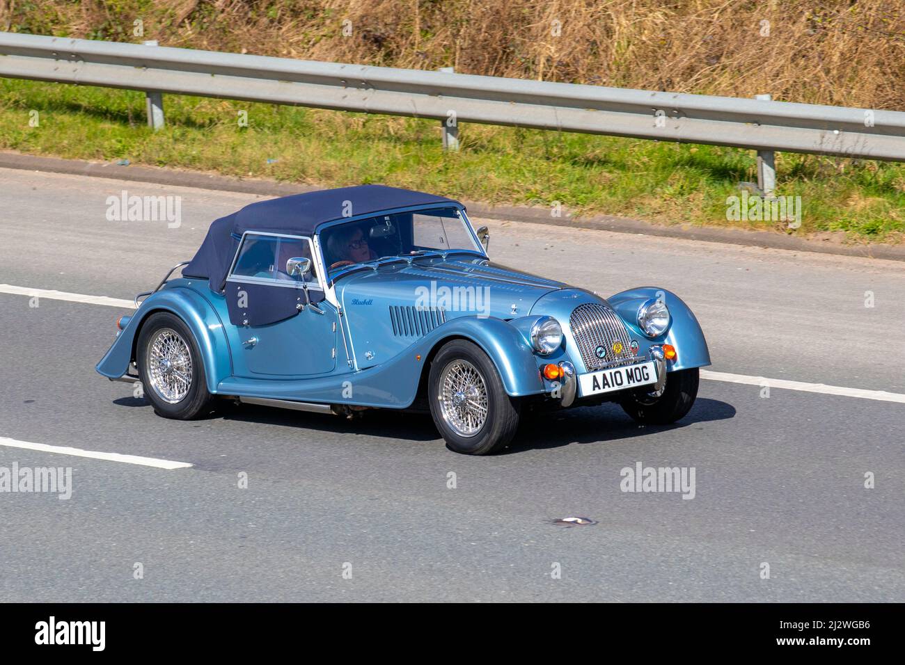 2016 blue 'Bluebell' Morgan 4x4 1595cc convertible roadster; driving on ...