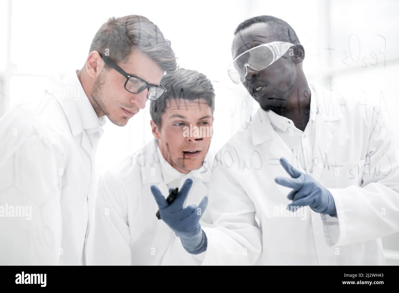 group of scientists talking in the laboratory Stock Photo - Alamy