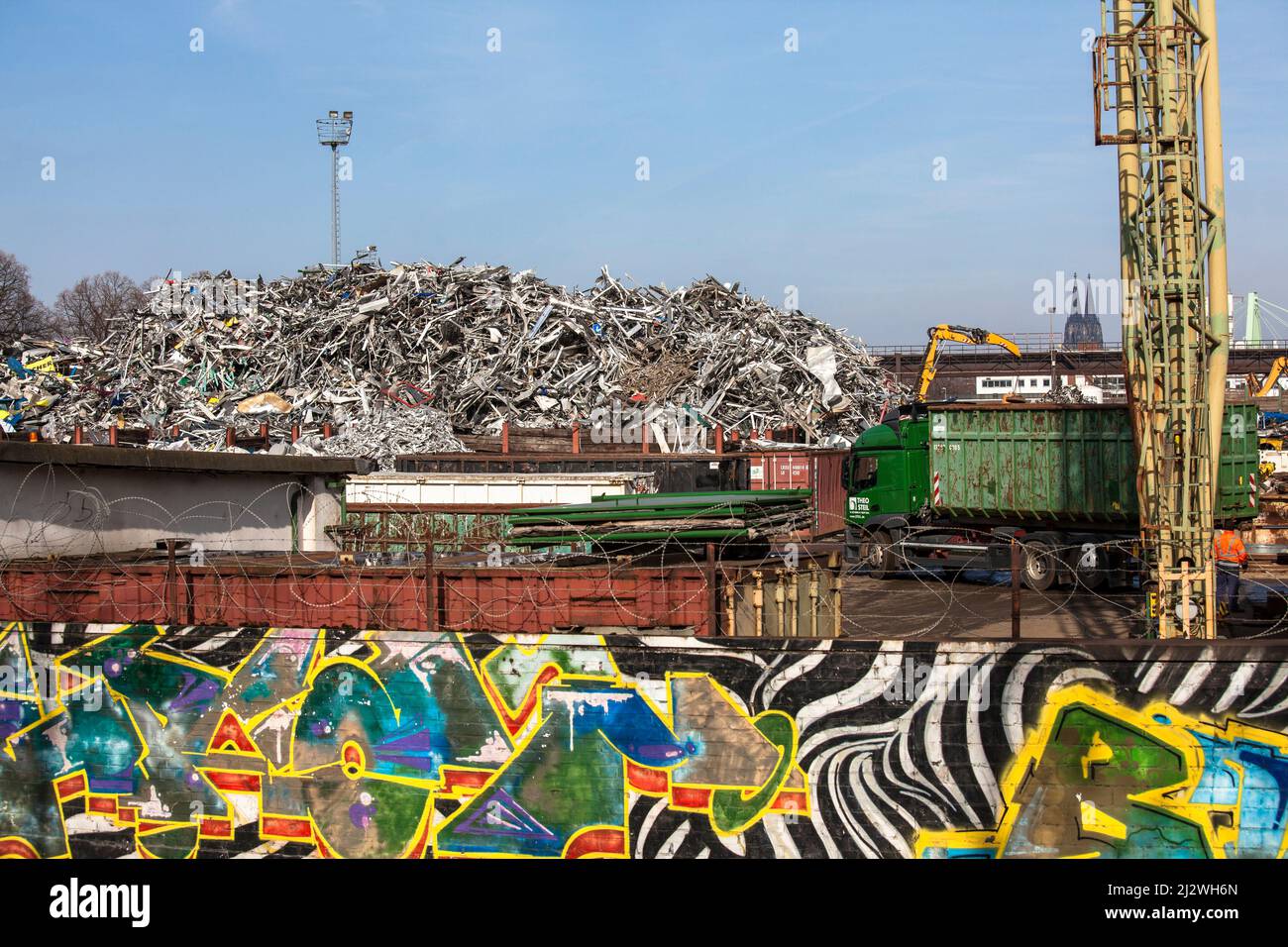 scrap yard with old metal in the district Deutz, in the background the ...
