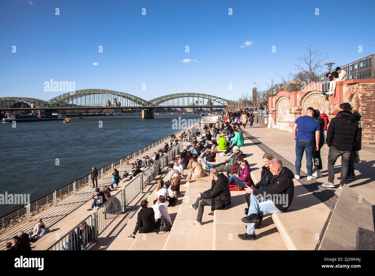 people at the Rhine boulevard in the district Deutz, Hohenzollern ...
