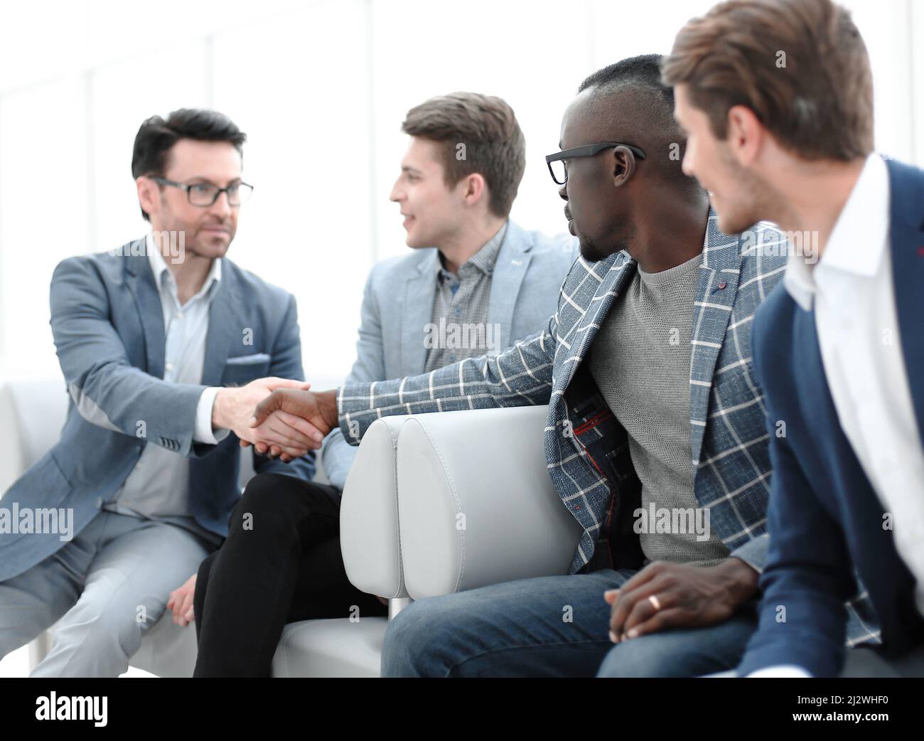 business colleagues reaching out for a handshake Stock Photo - Alamy