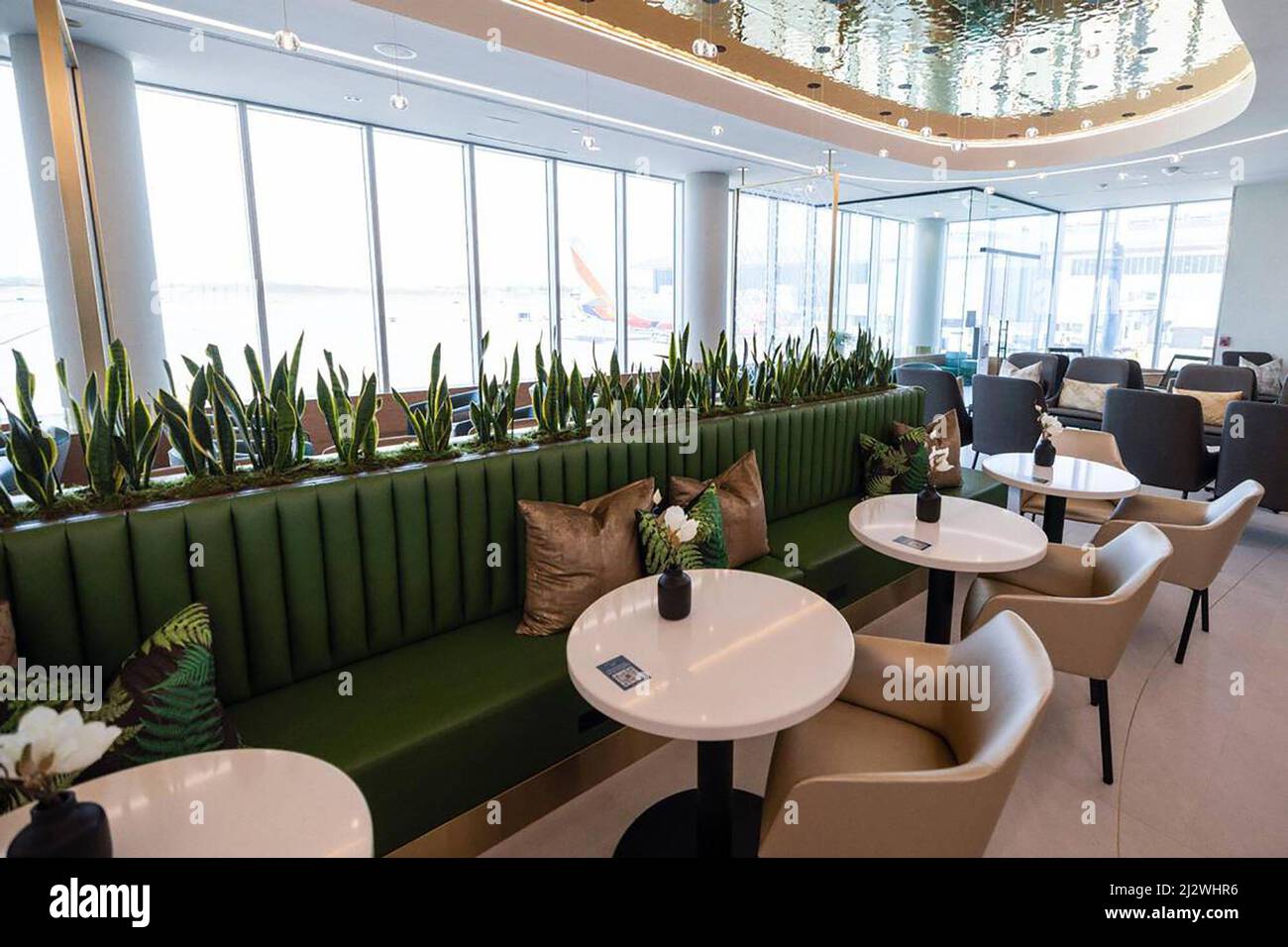 March 31, 2022: Customers at new airport lounge The Club CLT can order ...