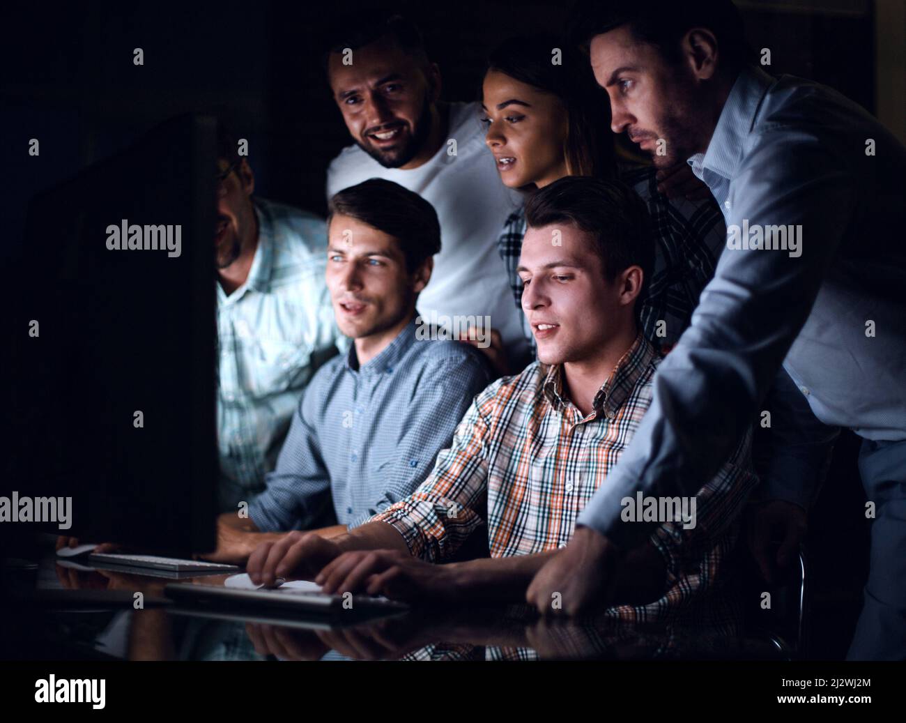business team looks closely at the computer monitor Stock Photo - Alamy