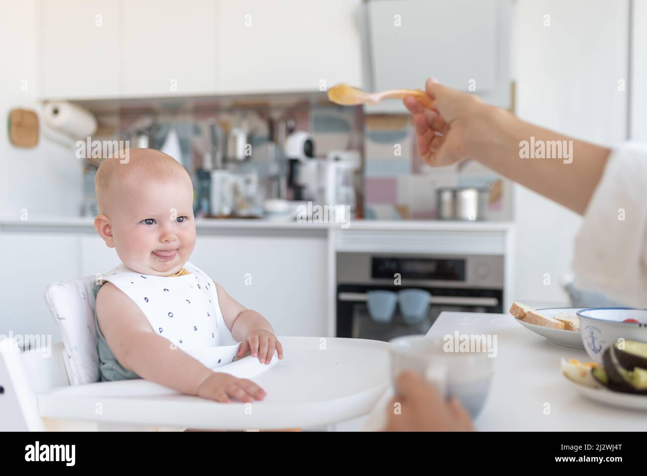 first feeding of the child, the child refuses to eat Stock Photo - Alamy