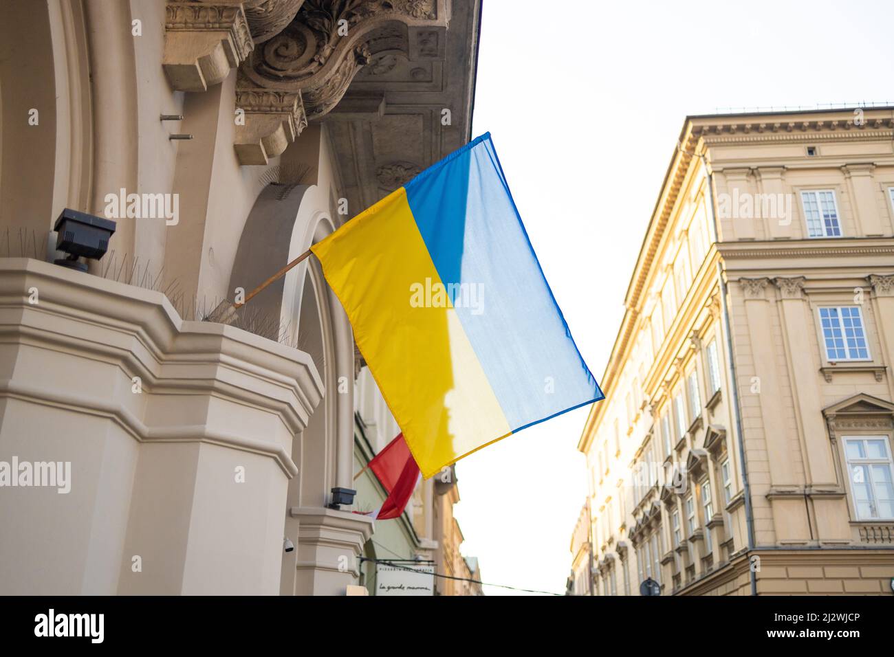 Ukrainian flag in city building. War in Ukraine Stock Photo - Alamy