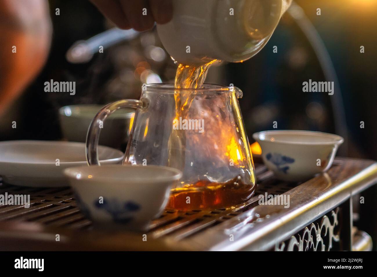 Tea ceremony, pours tea close-up, selective focus, brewing Chinese tea ...
