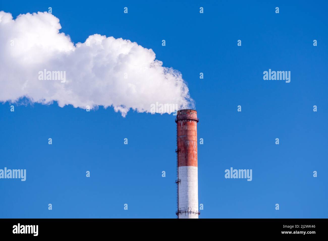 Smoke stack with smoke emission. Plant pipes pollute atmosphere ...