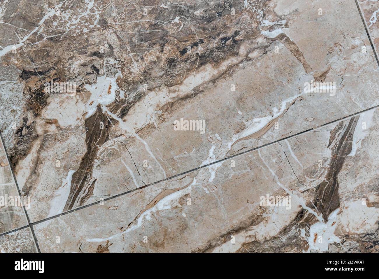 Tile on the floor is brown with a pattern of background texture ...