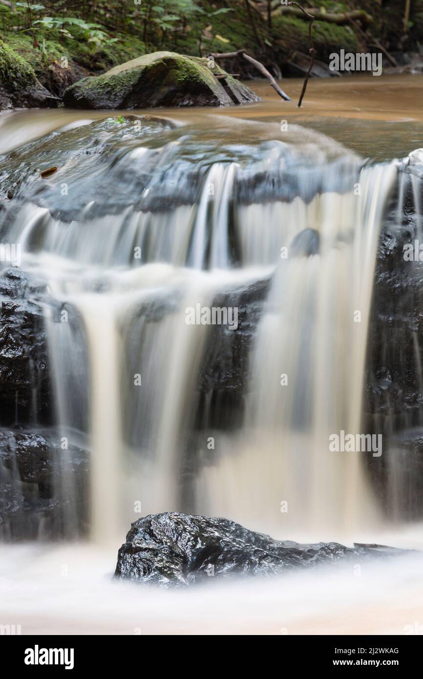 Long exposure detail shot of a small Nairobi River waterfall in Karura ...
