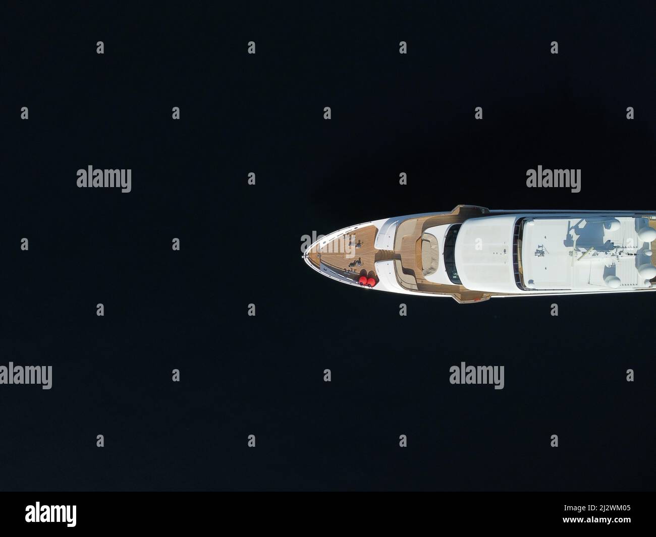 Aerial - Top down view of catching luxury motor boat racing on the ...