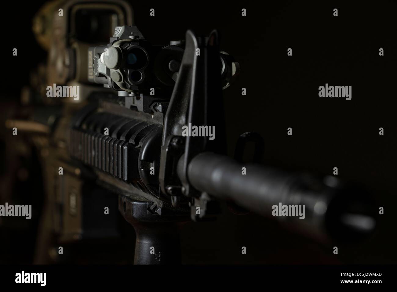 m4 rifle with optical sight and laser device on dark background Stock ...