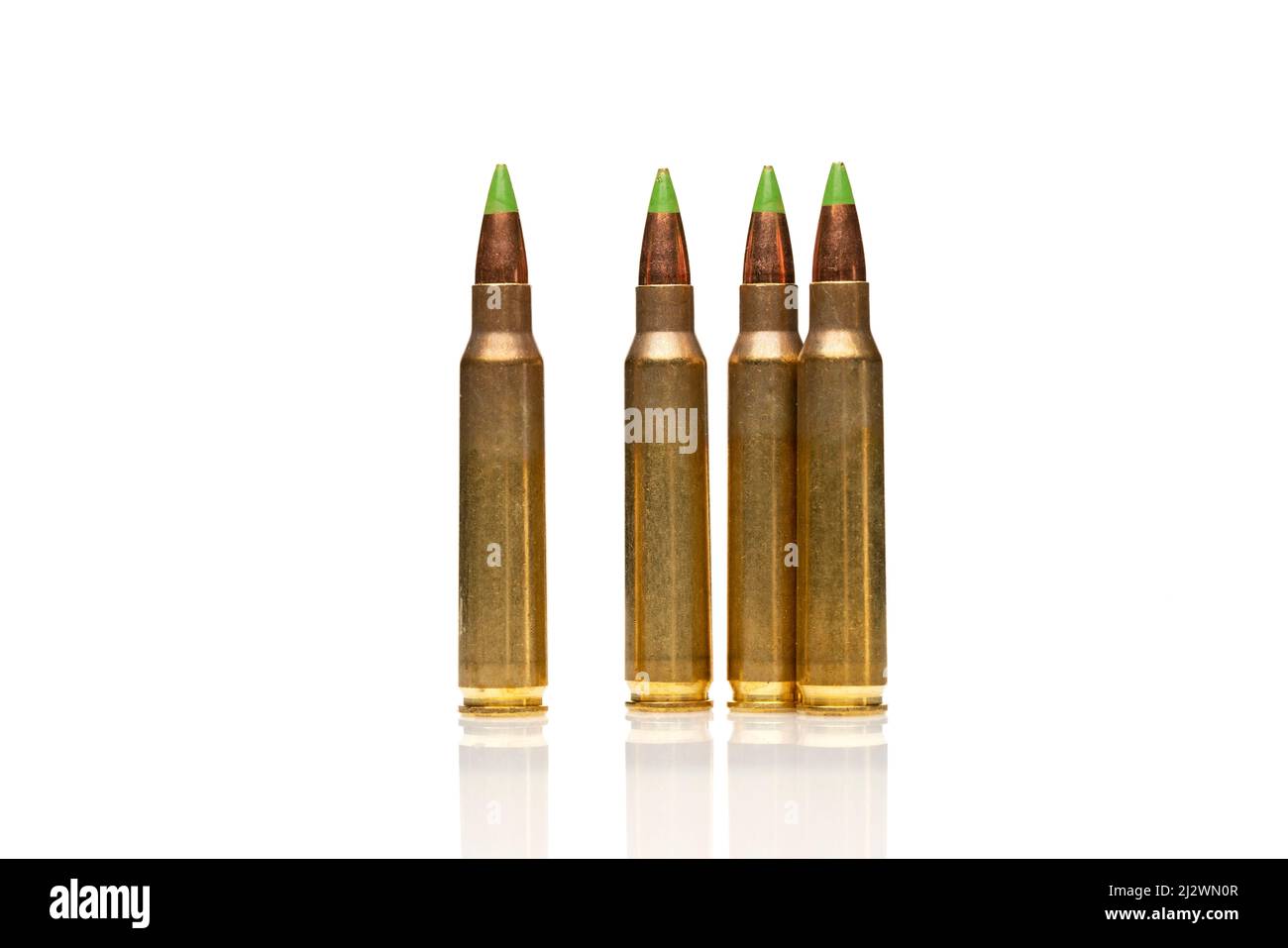A group of 5.56 calibar, green tip bullets on white background Stock ...