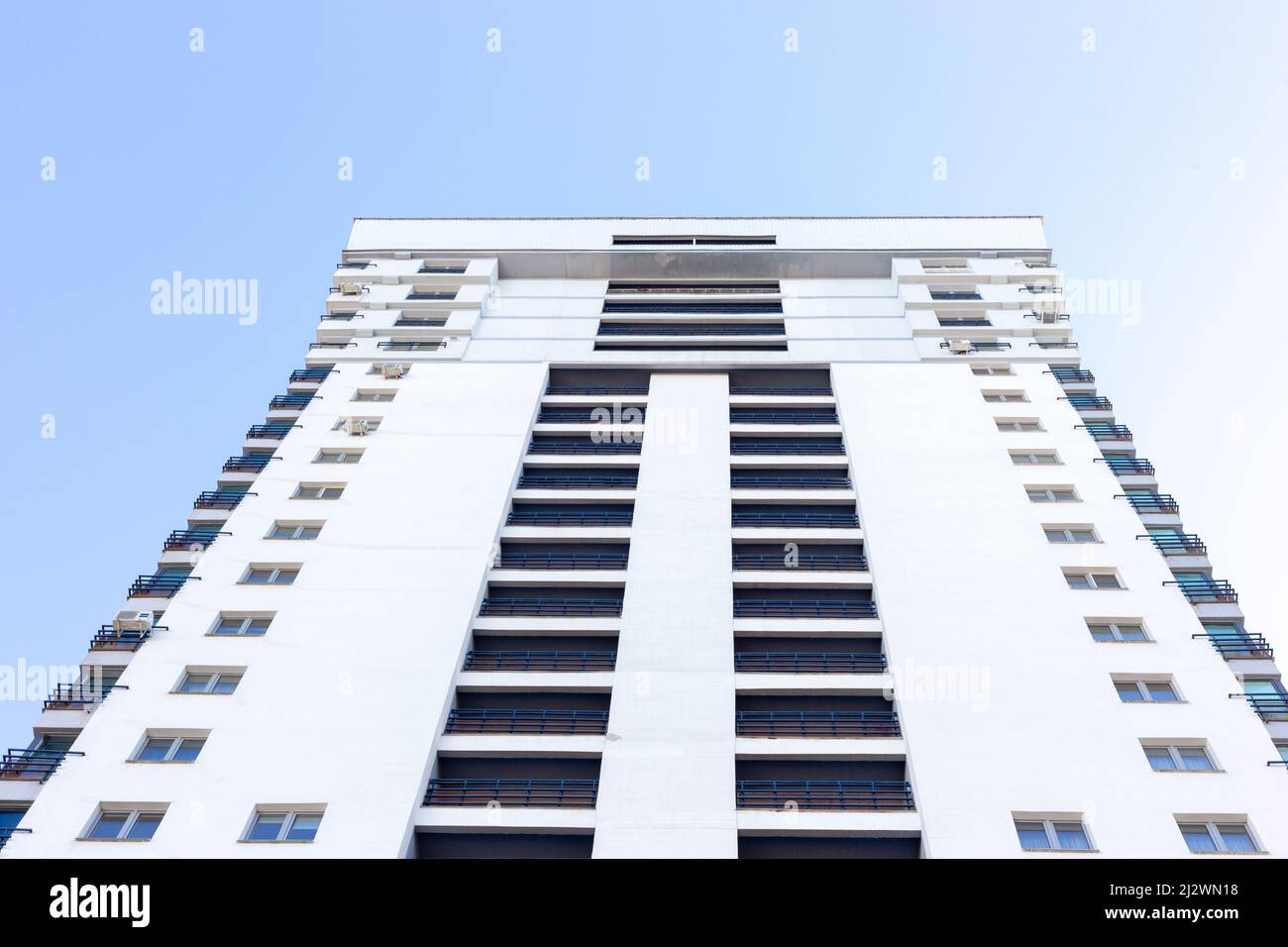 Residential high-rise building bottom view against the sky Stock Photo ...