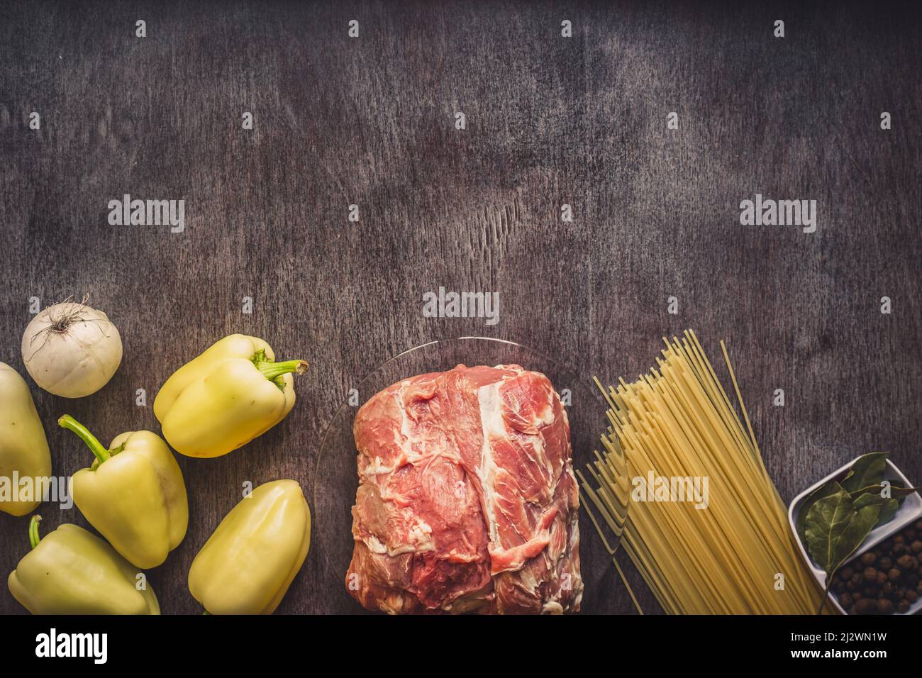 Raw meat beef with spaghetti, fresh organic vegetables, onion, garlic ...
