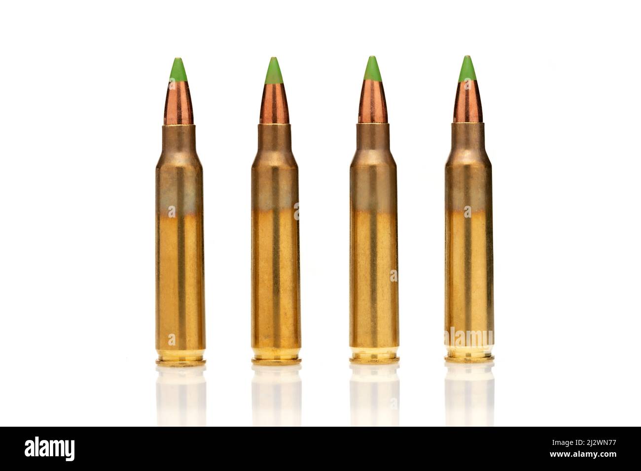 A group of 5.56 calibar, green tip bullets ordered into the line on ...