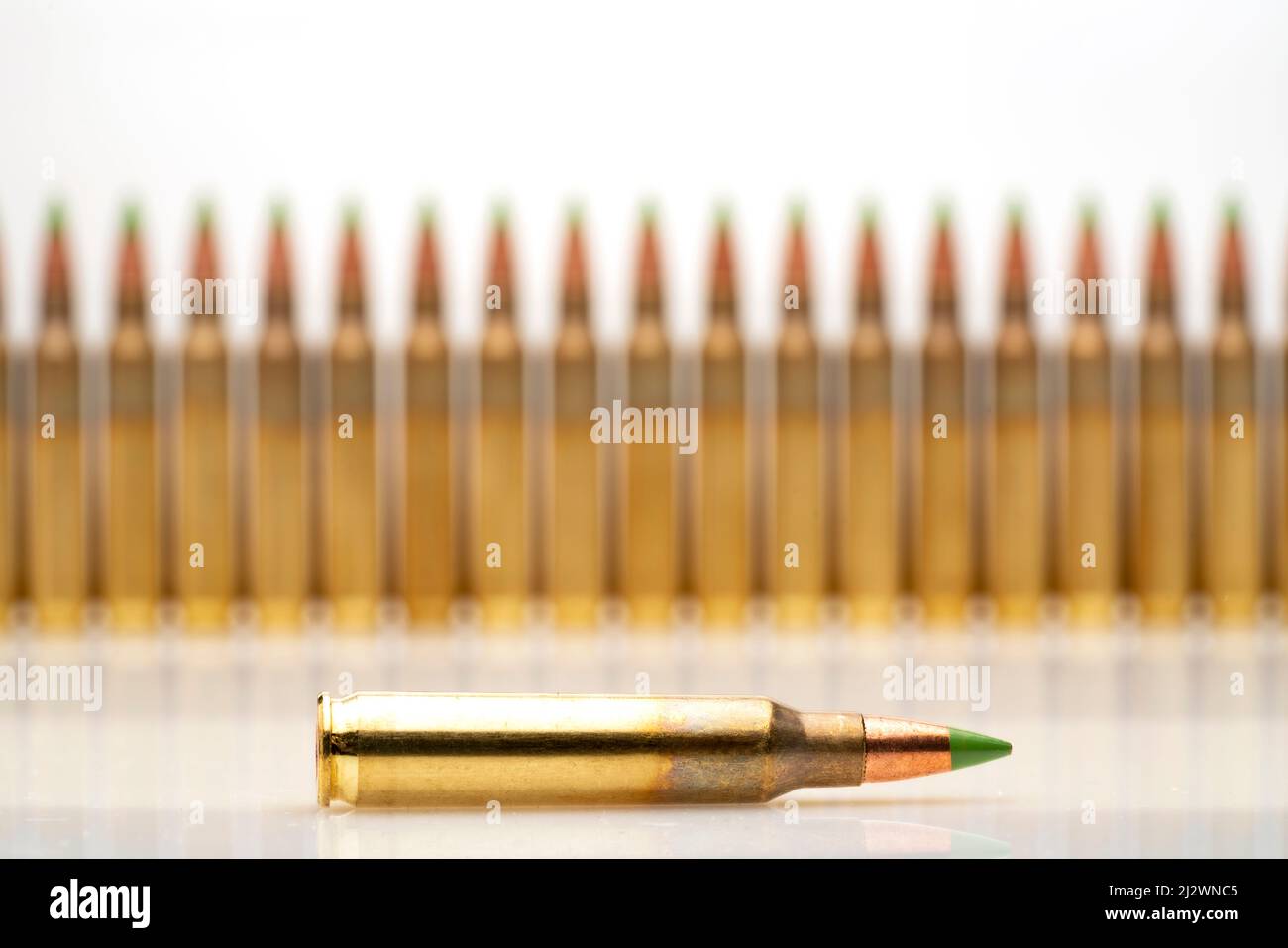 A group of 5.56 calibar, green tip bullets on white background Stock ...